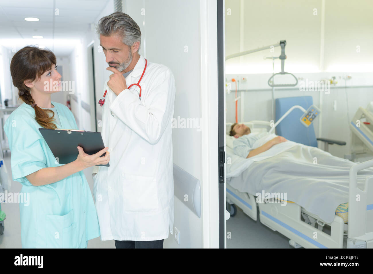 Hospital staff discussing patients medical hi-res stock photography and ...