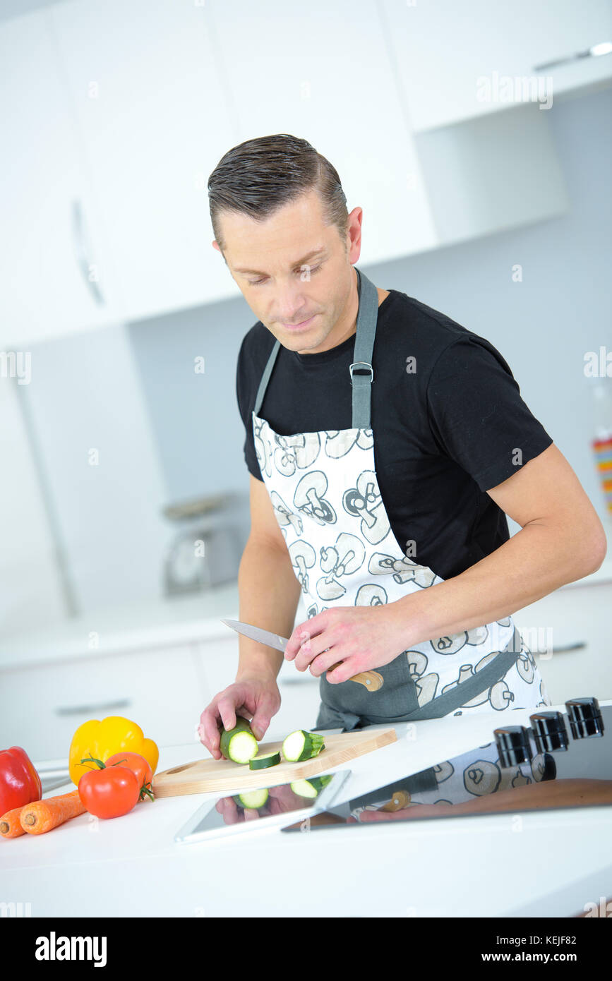 man cutting vegetables Stock Photo - Alamy