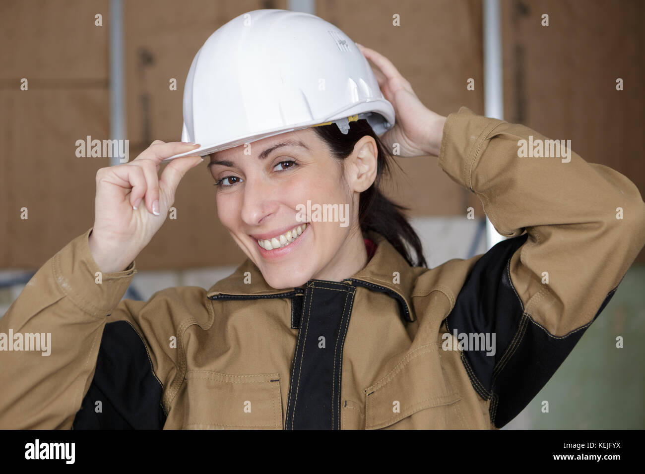 young happy female builder Stock Photo - Alamy