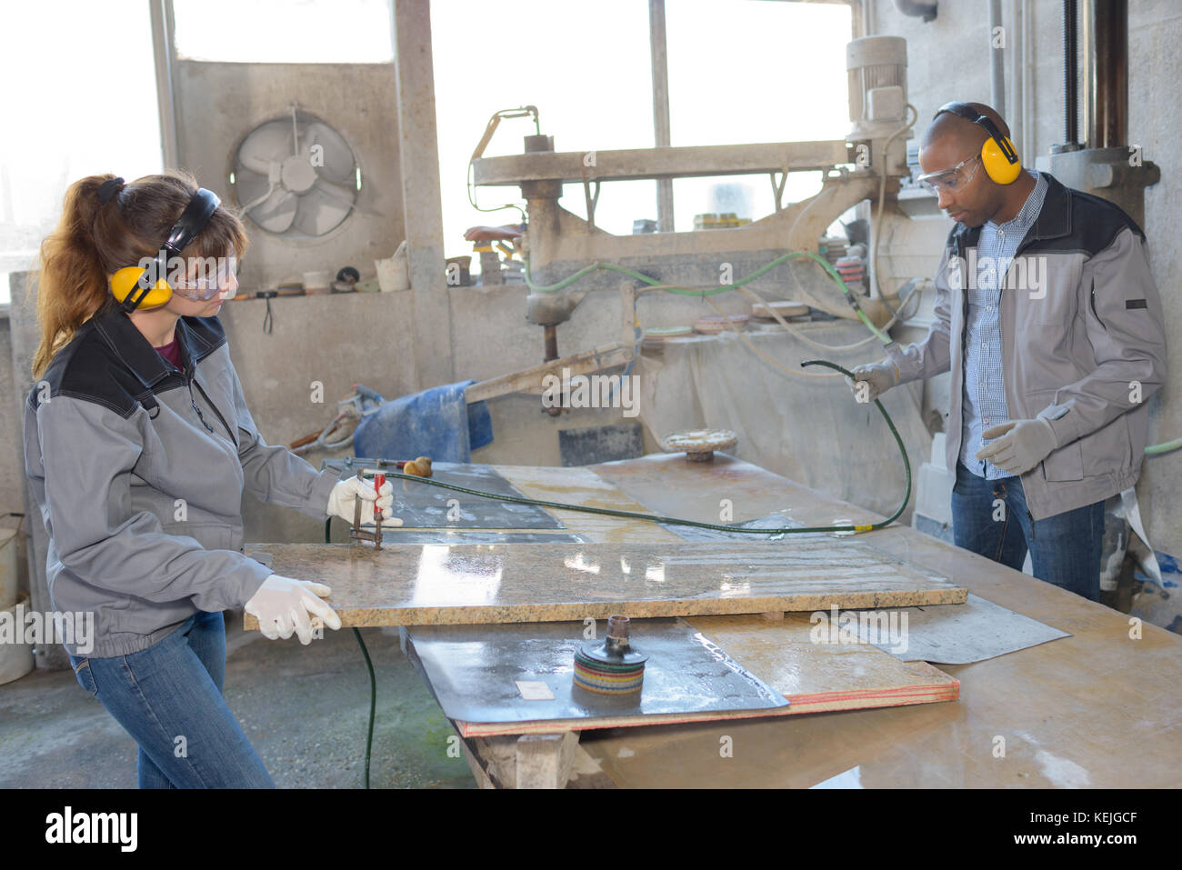 People working with slabs of marble Stock Photo - Alamy