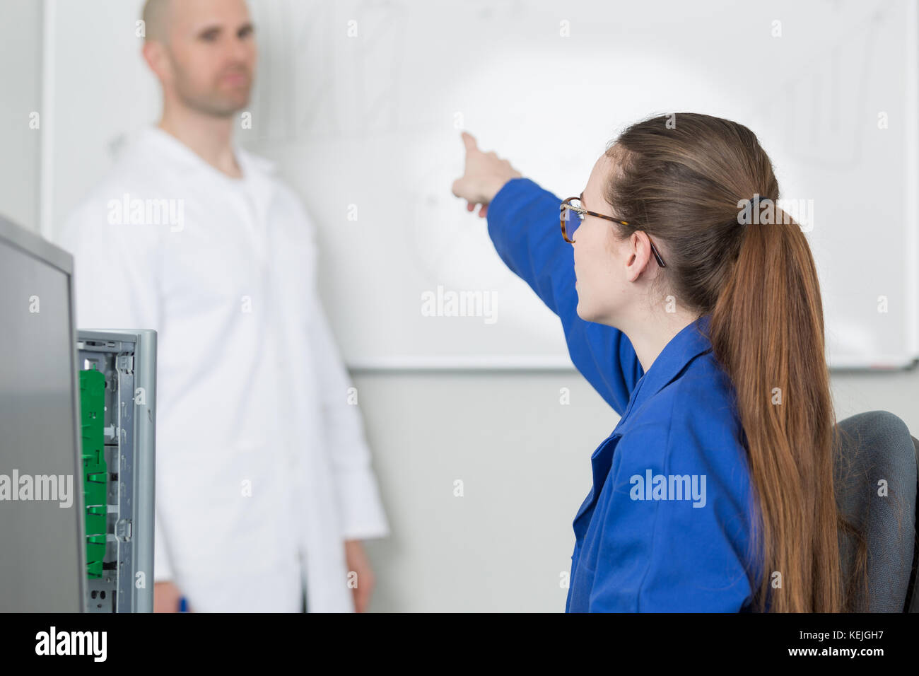 tutor and student fixing computer in class Stock Photo - Alamy