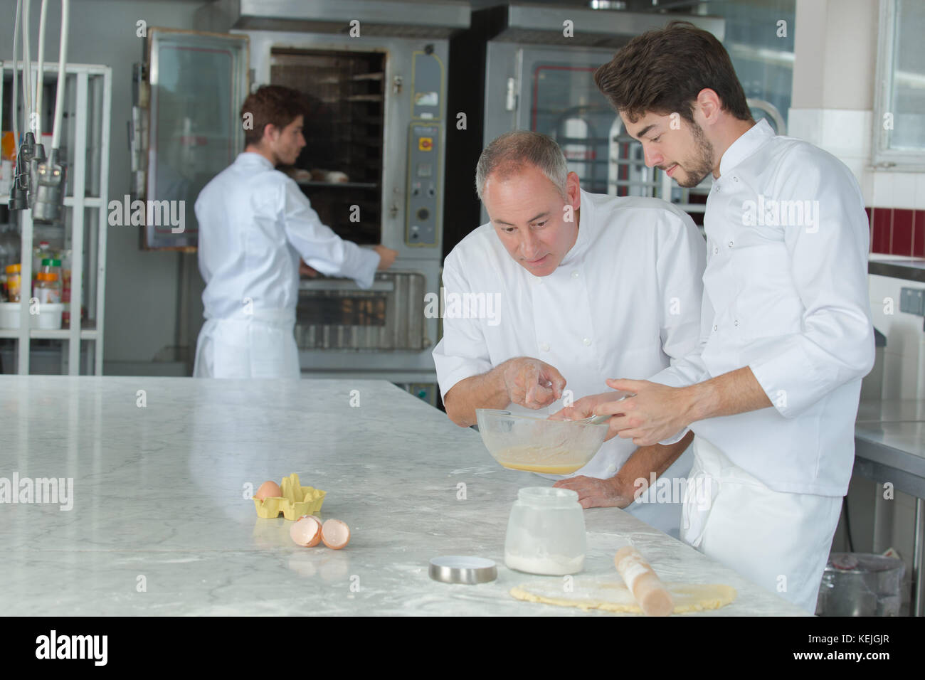 bakery teacher with students in school kitchen Stock Photo - Alamy