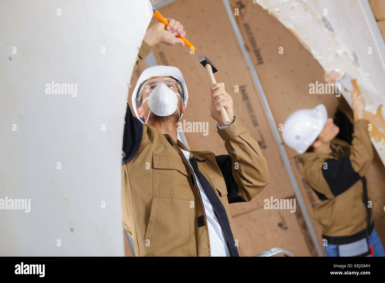 breaking brick wall with hammer Stock Photo - Alamy