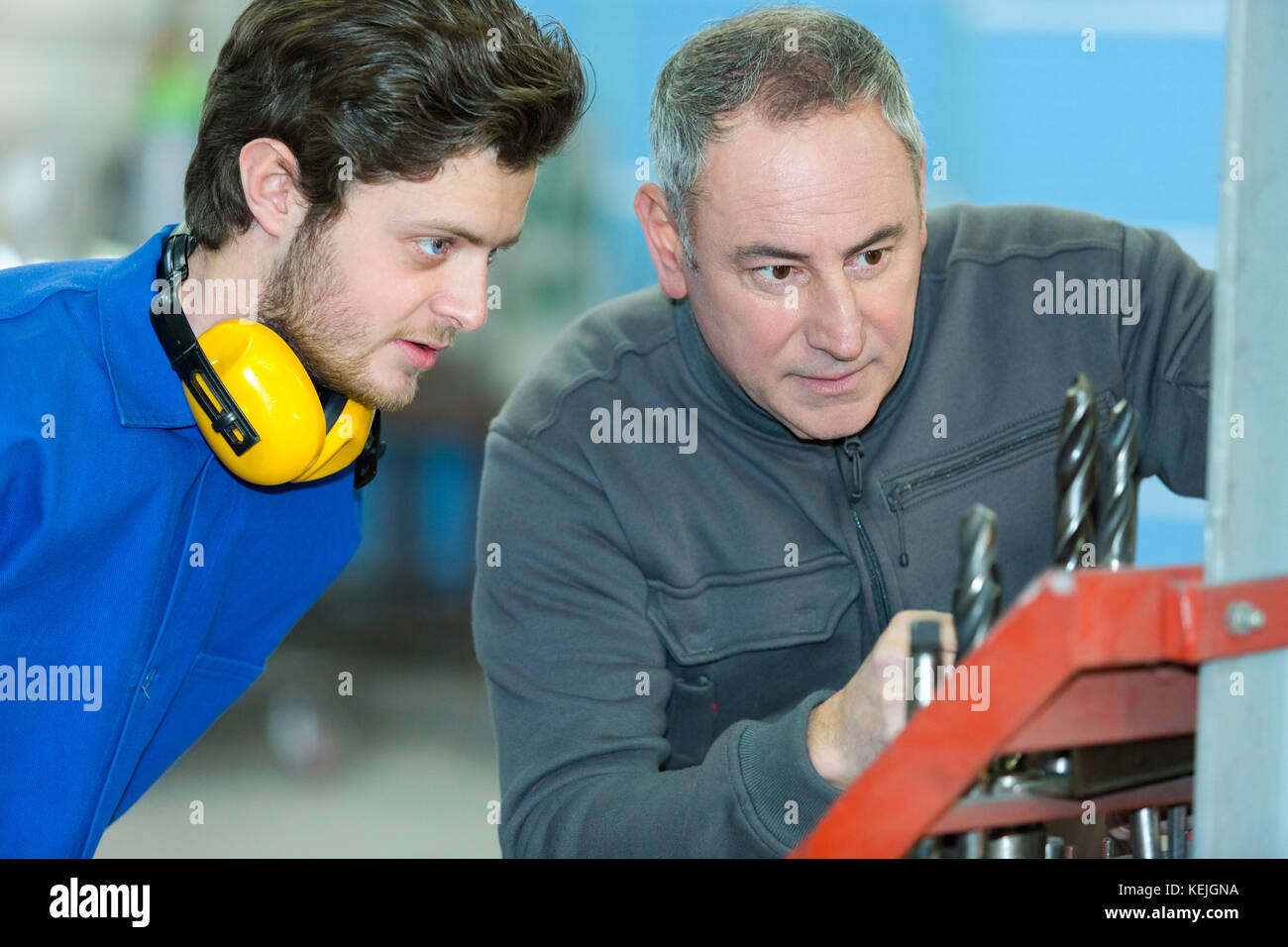 male engineer in factory using milling machine Stock Photo - Alamy