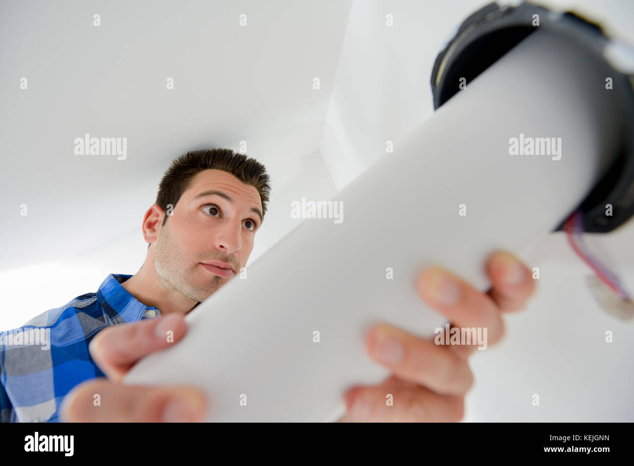 Man placing a pipe Stock Photo - Alamy