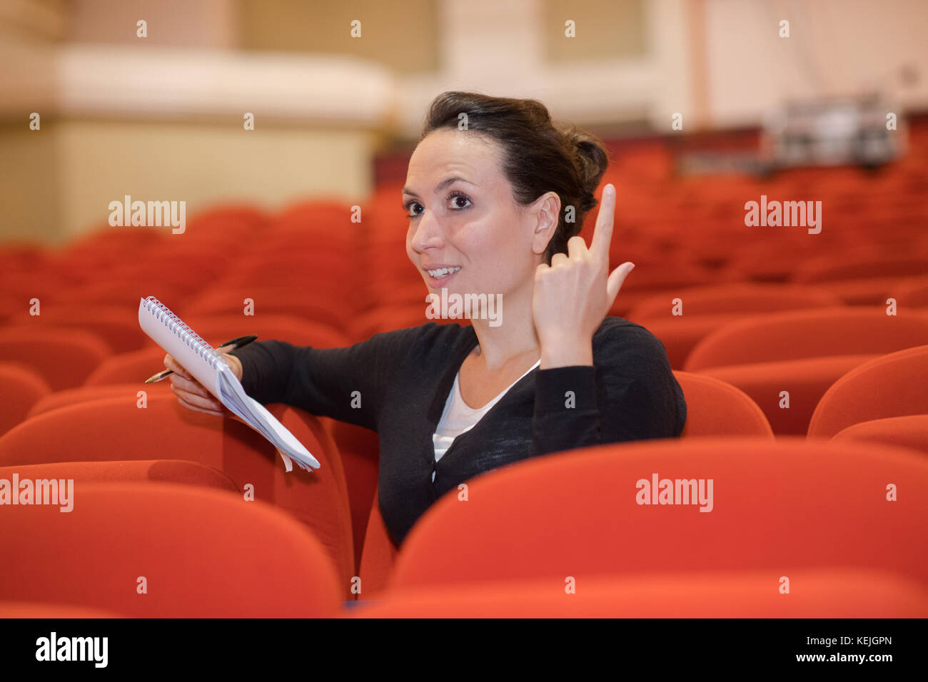 woman in theatre seat Stock Photo - Alamy