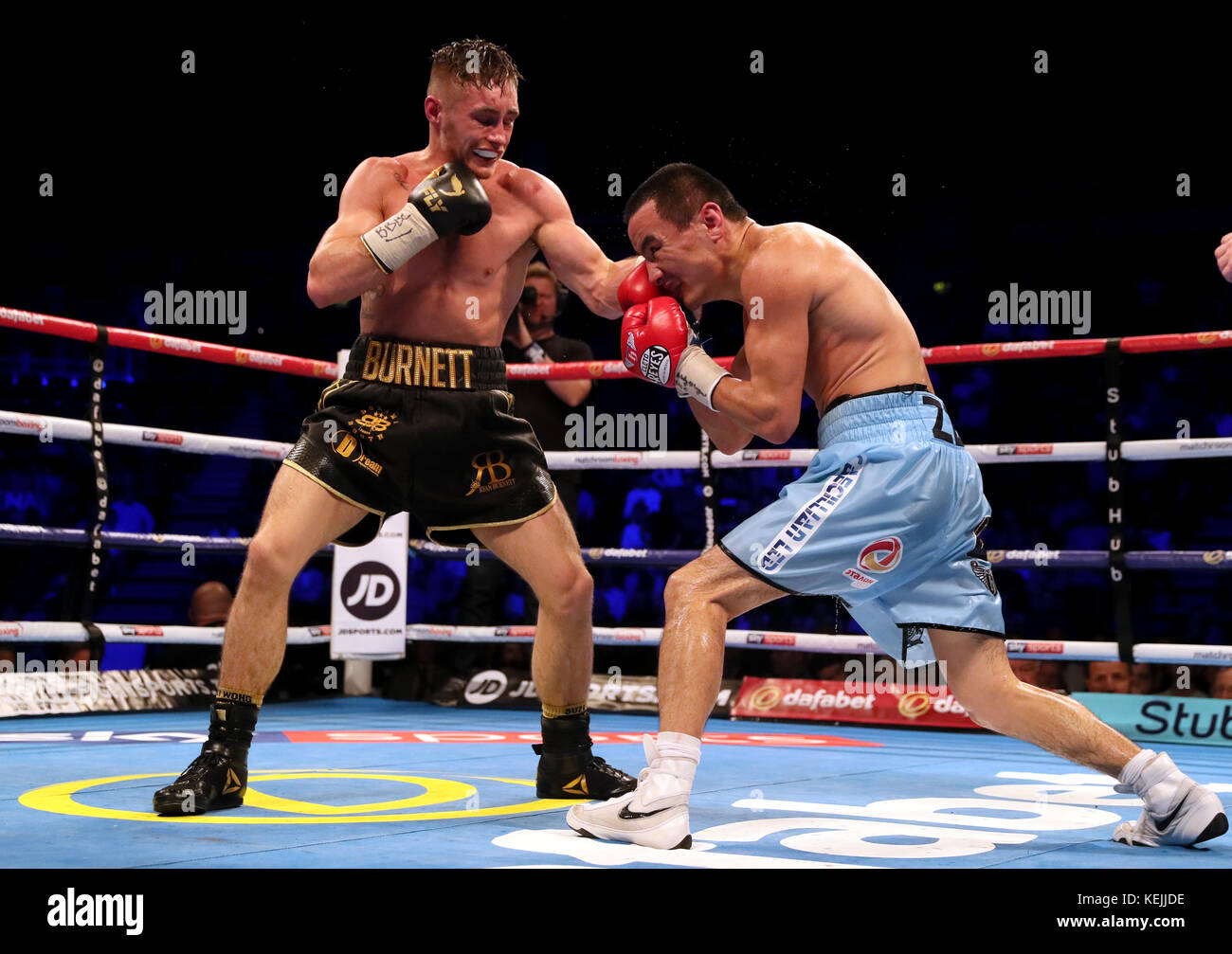 Ryan Burnett (right) in action against Zhanat Zhakiyanov in action ...