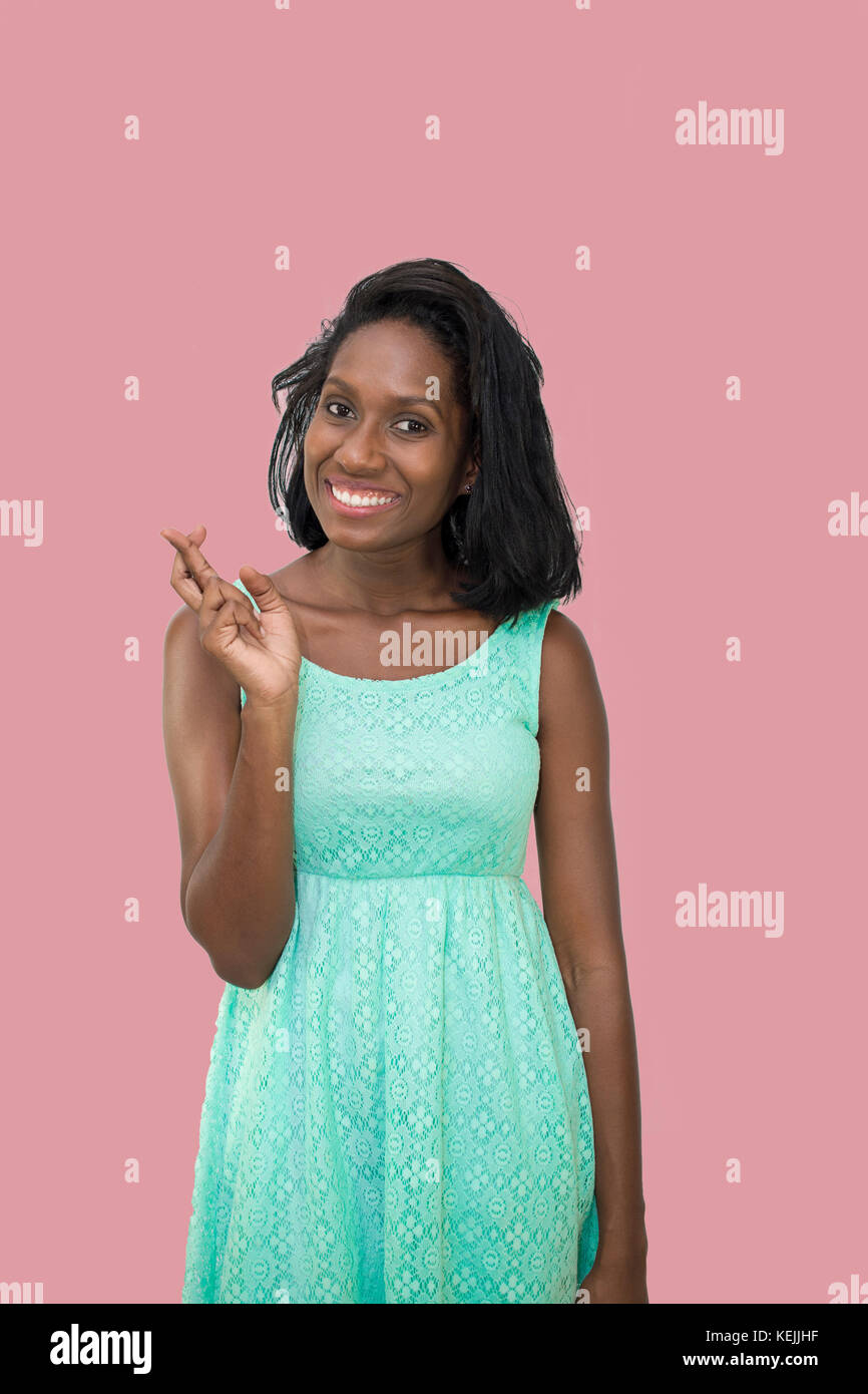 Girl with fingers crossed hi-res stock photography and images - Alamy