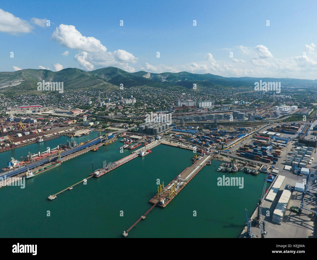 Industrial seaport, top view. Port cranes and cargo ships and barges ...