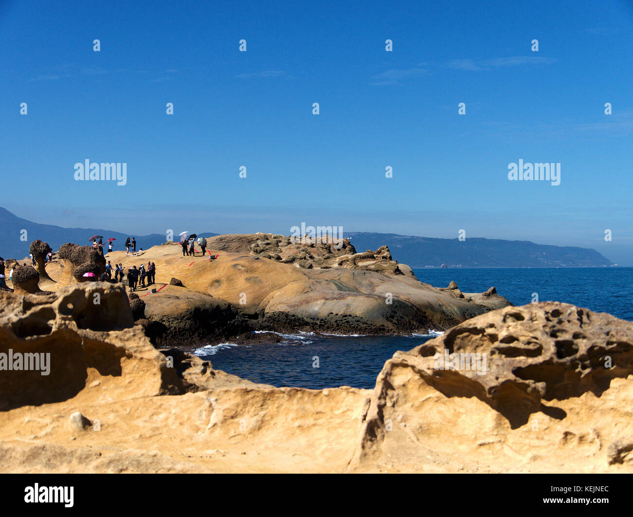 Visitors enjoying rock formations at Yehliu Geopark, Wanli, Taiwan ...