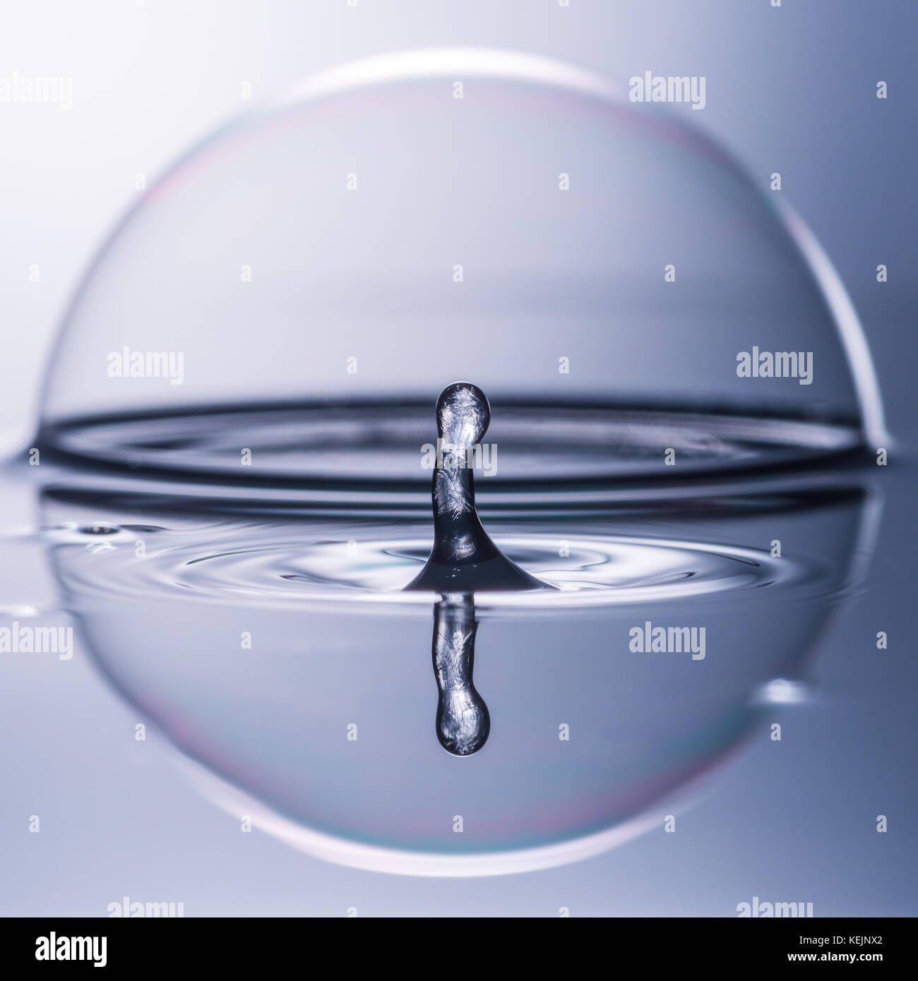 A water splash shot in front of a soap bubble Stock Photo - Alamy