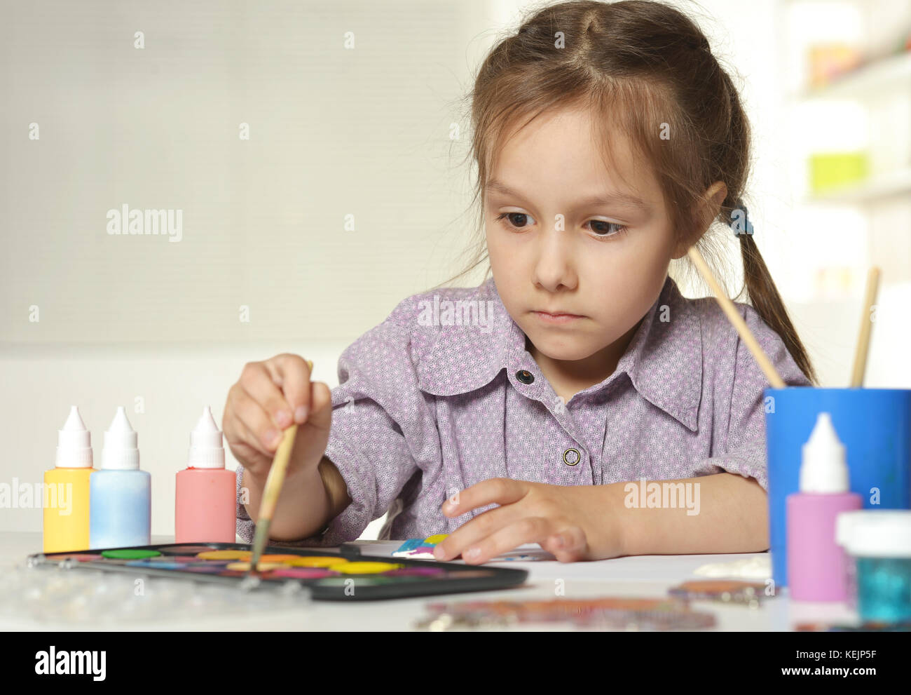 girl painting in room Stock Photo - Alamy
