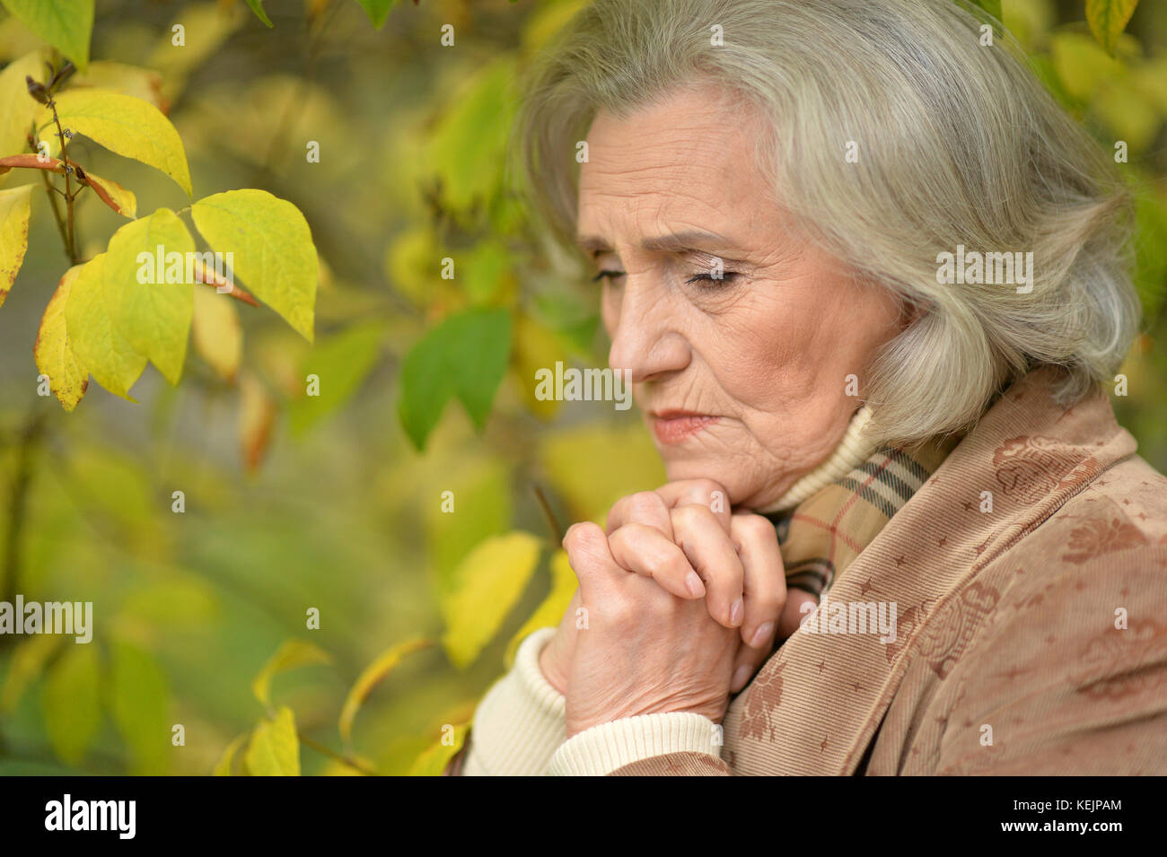 sad woman posing outdoors Stock Photo - Alamy