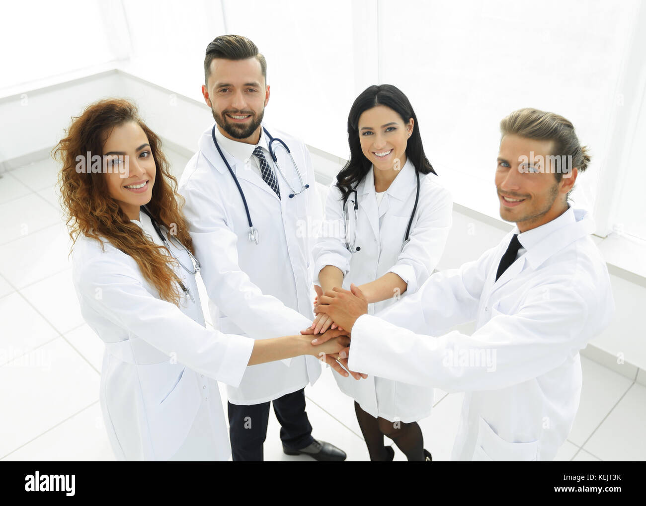friendly team of doctors shows their success Stock Photo - Alamy