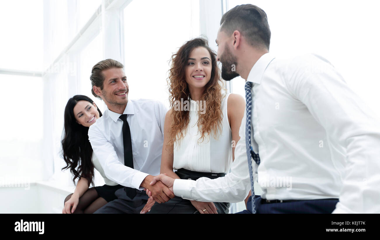 welcome handshake between two colleagues Stock Photo - Alamy