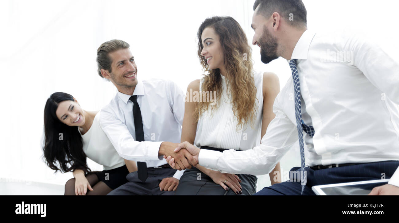 welcome handshake between two colleagues Stock Photo - Alamy