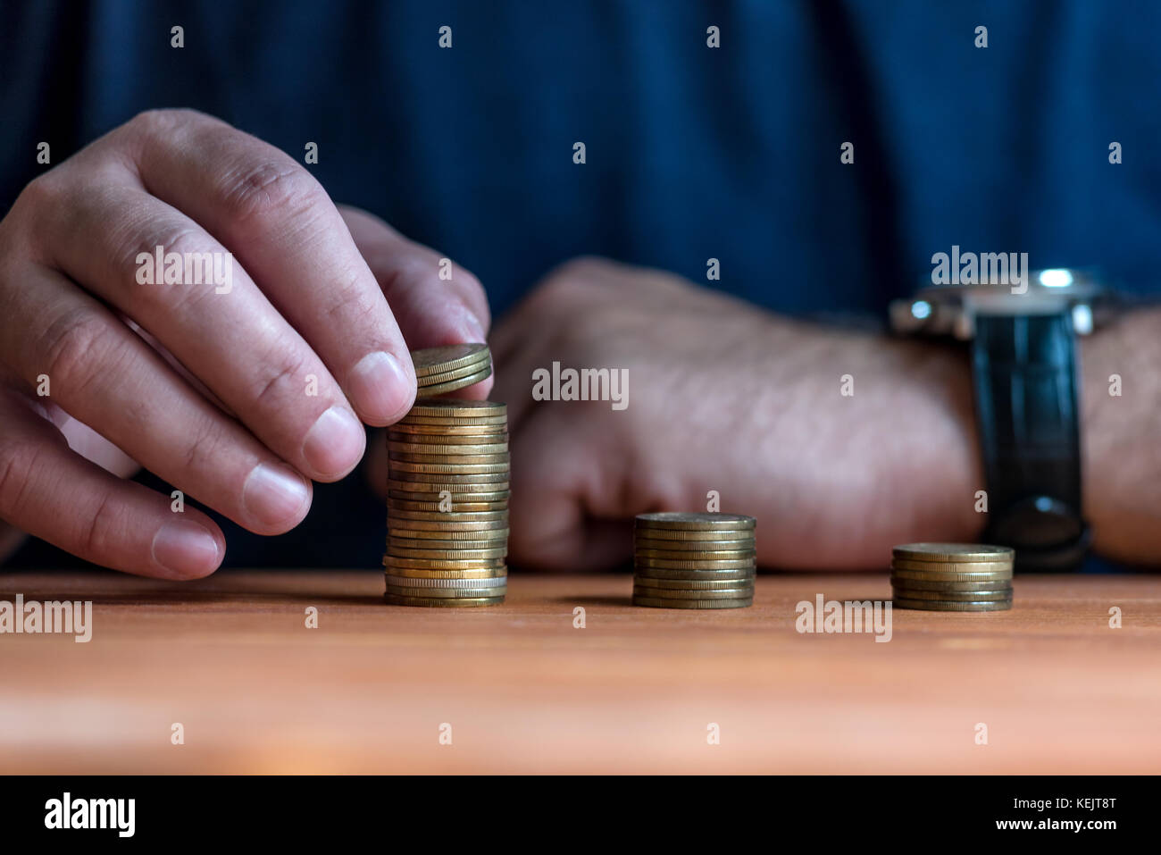Money stacking hi-res stock photography and images - Alamy