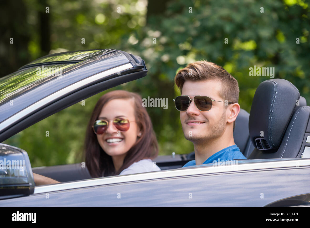 Close-up Of Young Happy Couple In A Car Stock Photo - Alamy