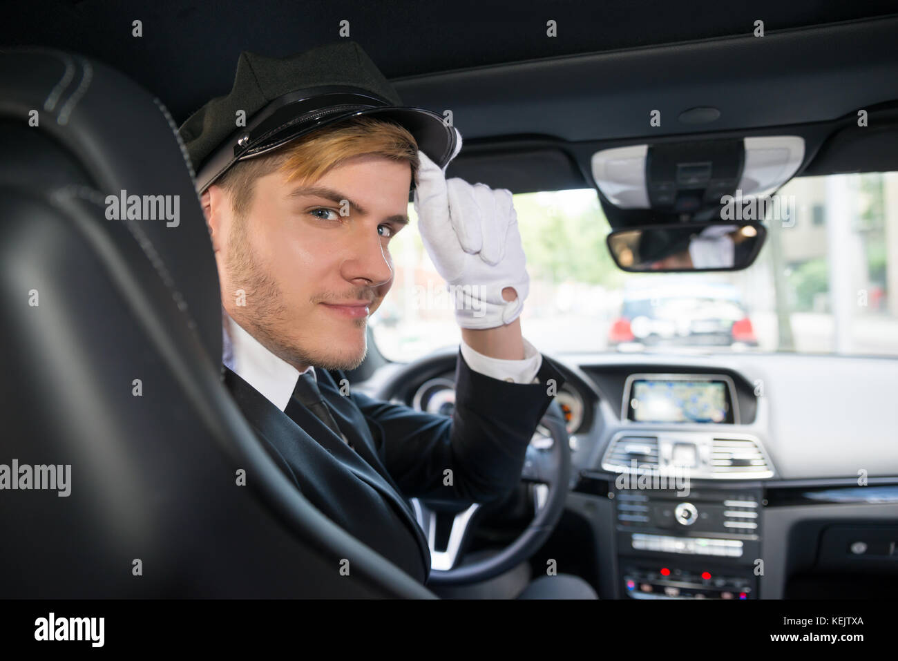 Portrait Of A Handsome Smiling Male Chauffeur Riding Car Stock Photo ...