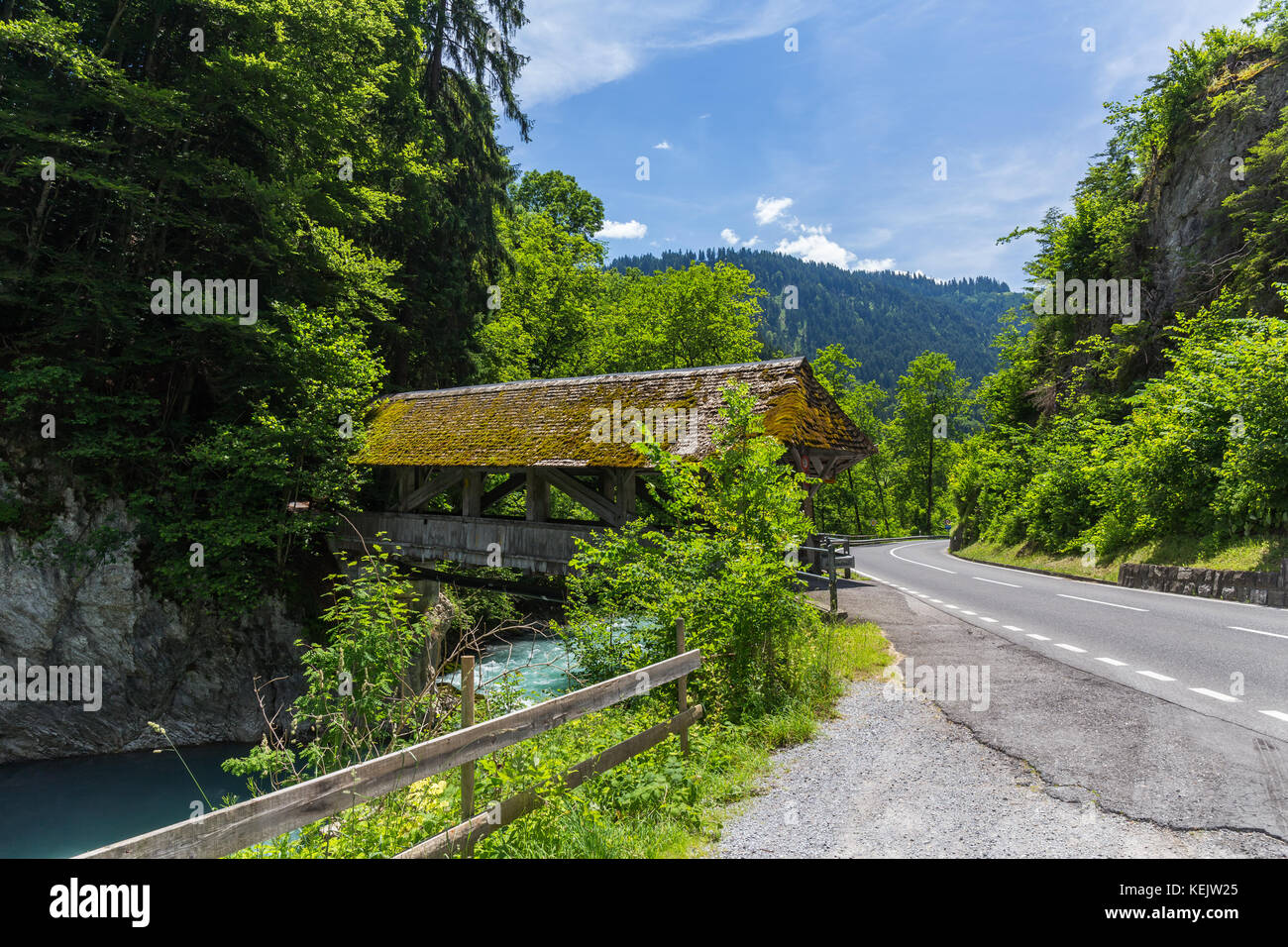 Traditional Covered Wood Bridge in mountain Switzerland Stock Photo - Alamy