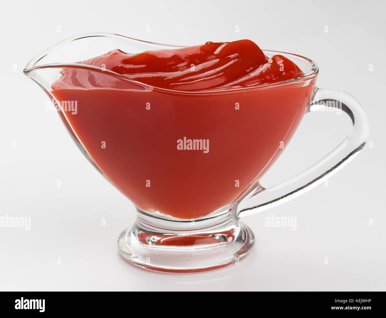 Glass bowl of ketchup isolated on white background Stock Photo - Alamy