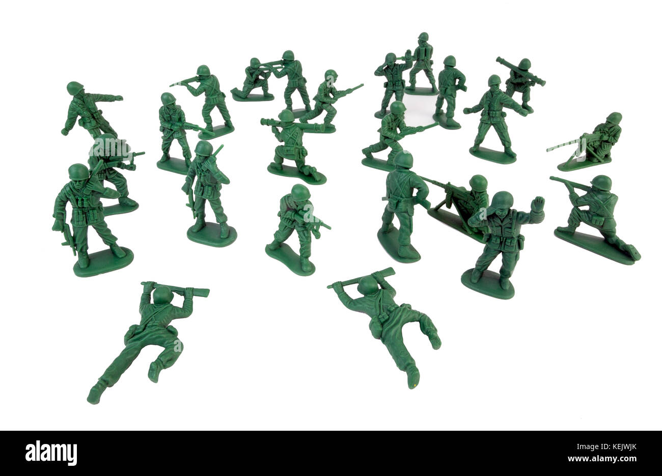 Bunch of disorganized plastic toy army men and women scattered on white ...