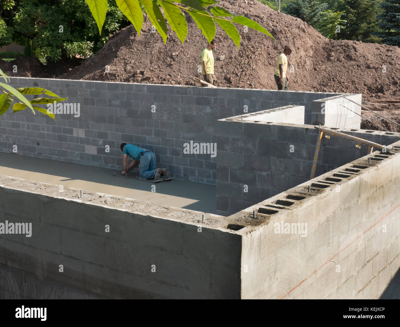 Masons working on new house Stock Photo - Alamy