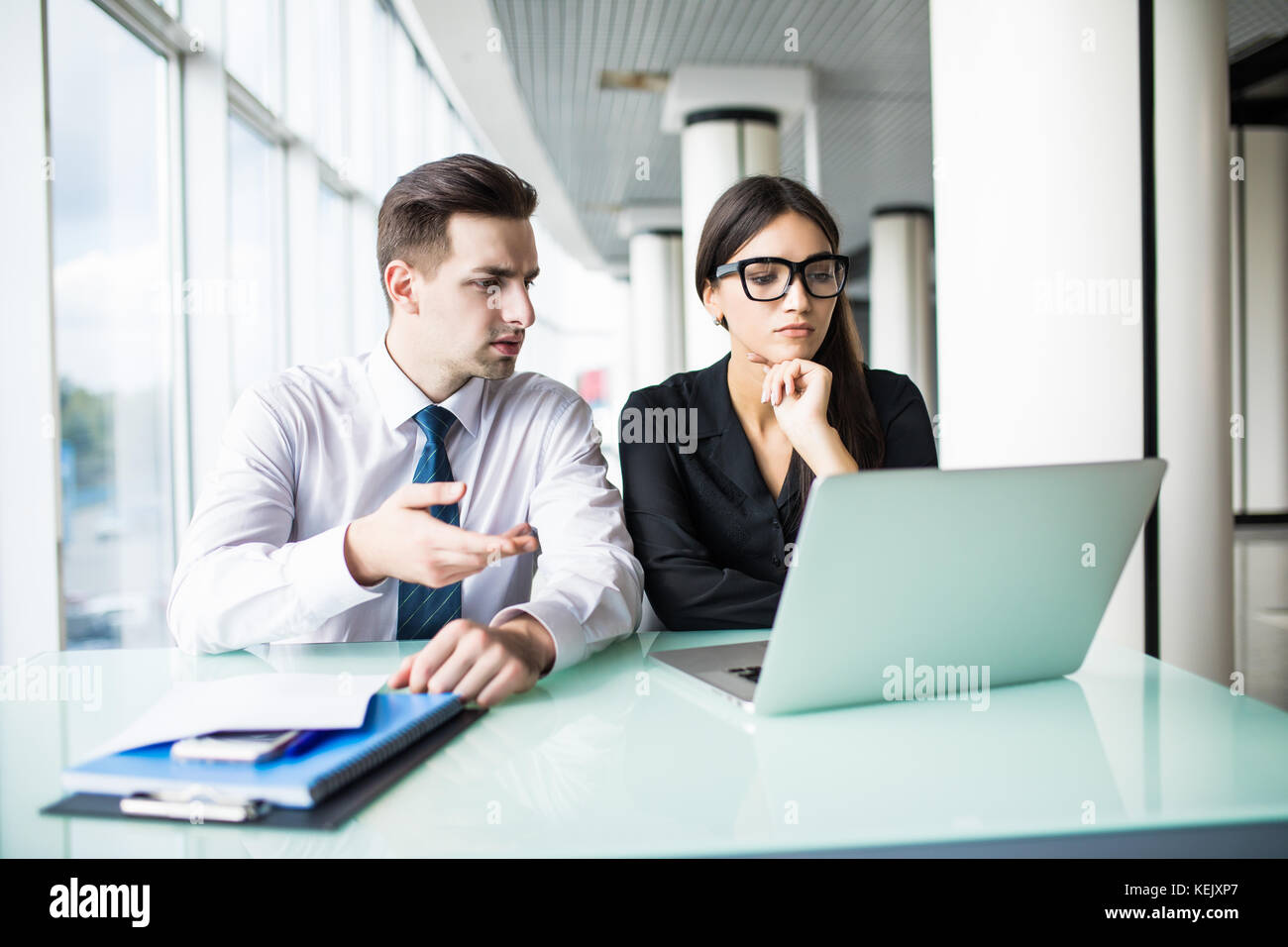 Business partners working on new project at modern office Stock Photo ...
