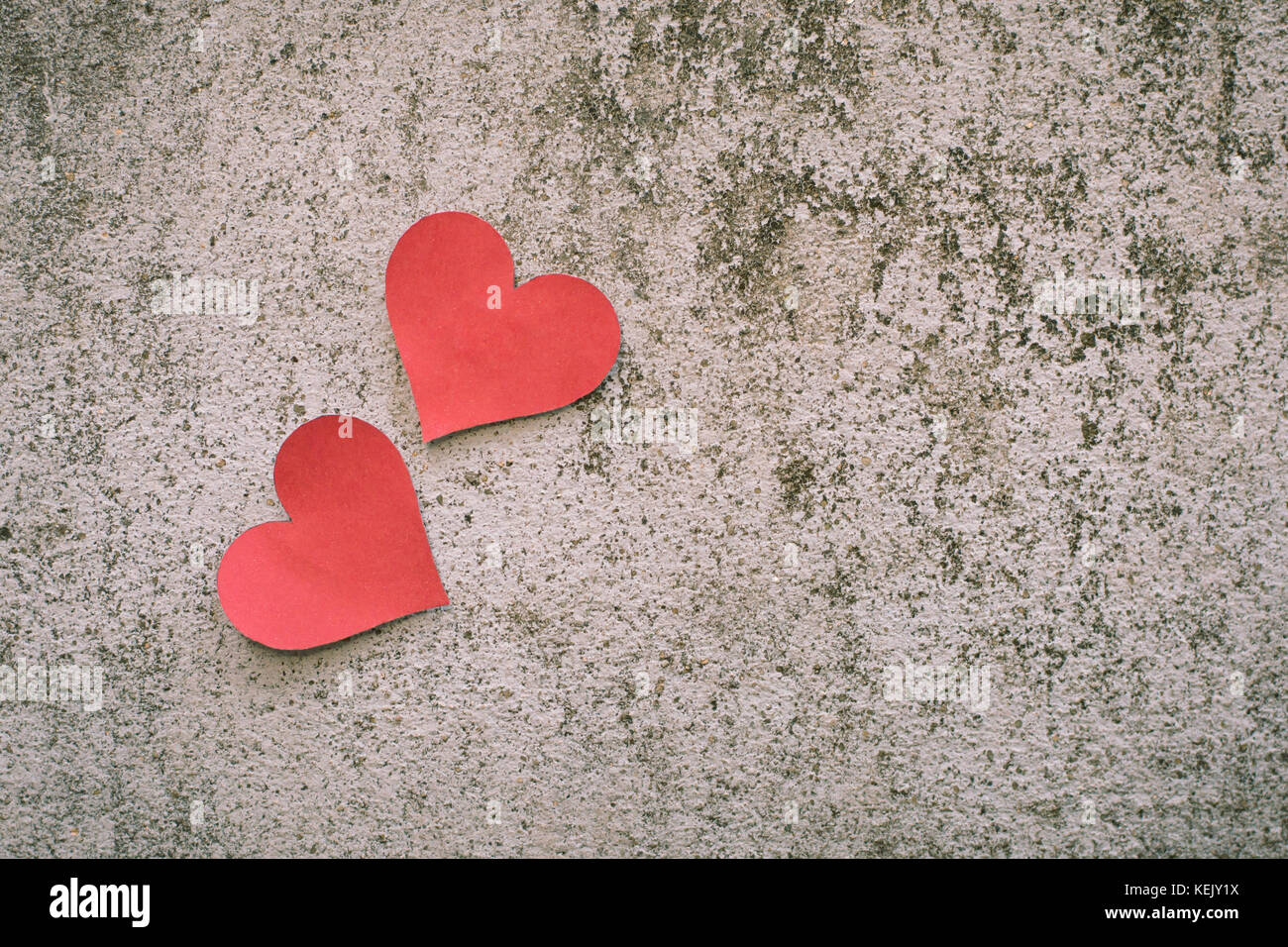 red paper heart shape on concrete background Stock Photo - Alamy