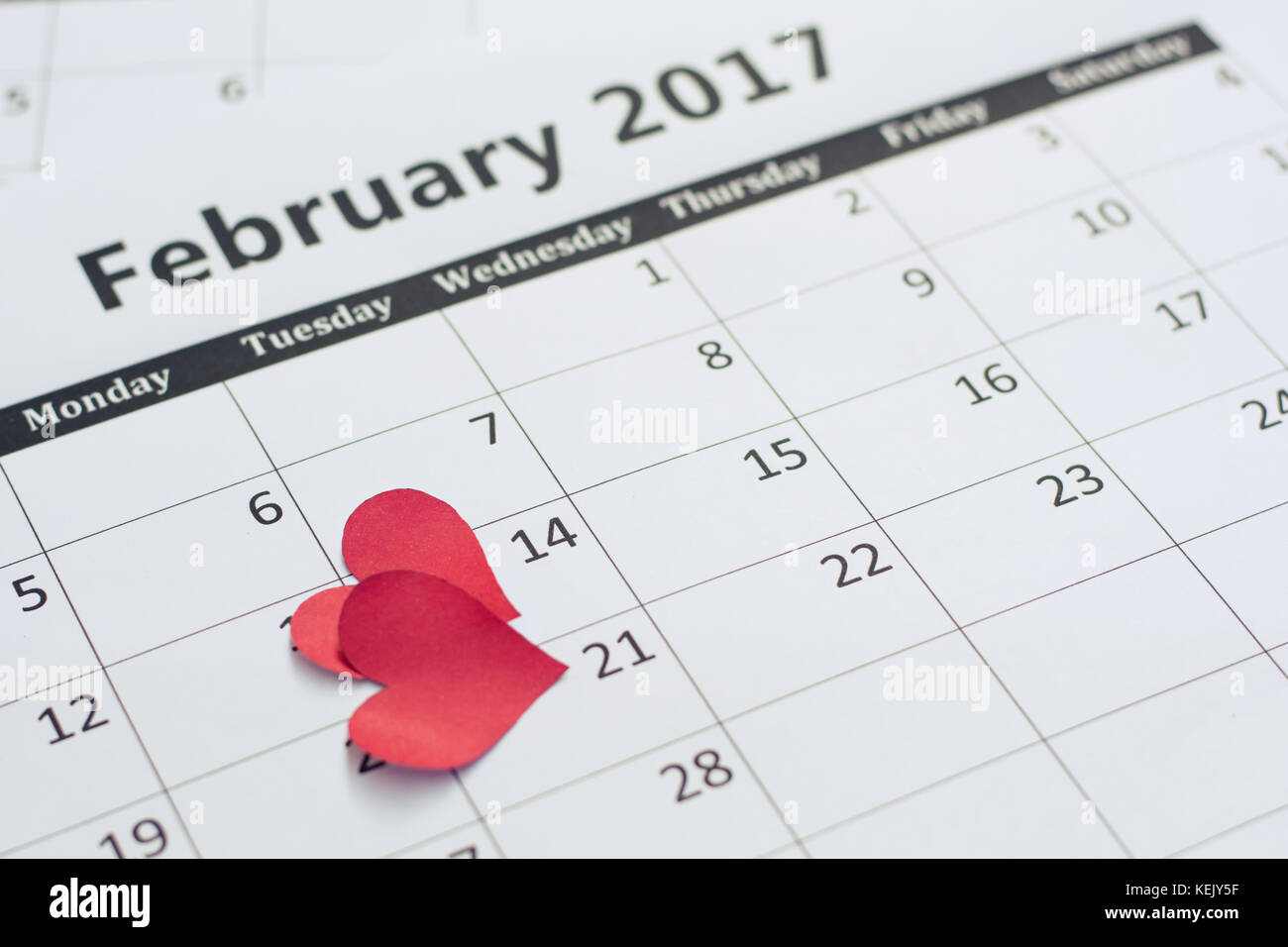 Calendar Valentines day and red hearts paper Stock Photo - Alamy