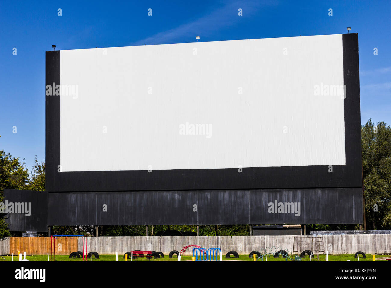 Old Time Drive-In Movie Theater with blank white screen for copy space ...