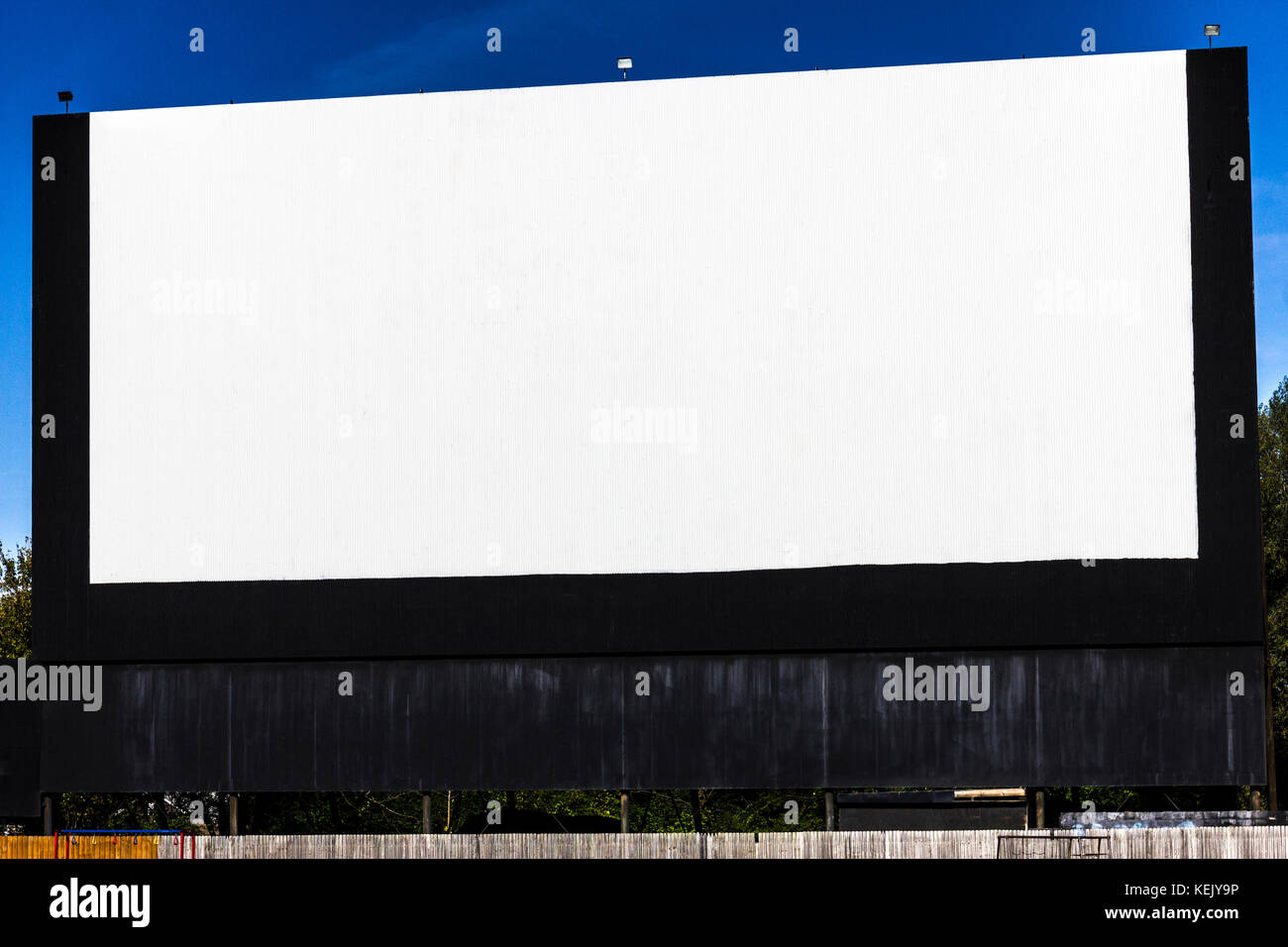 Old Time Drive-In Movie Theater with blank white screen for copy space ...