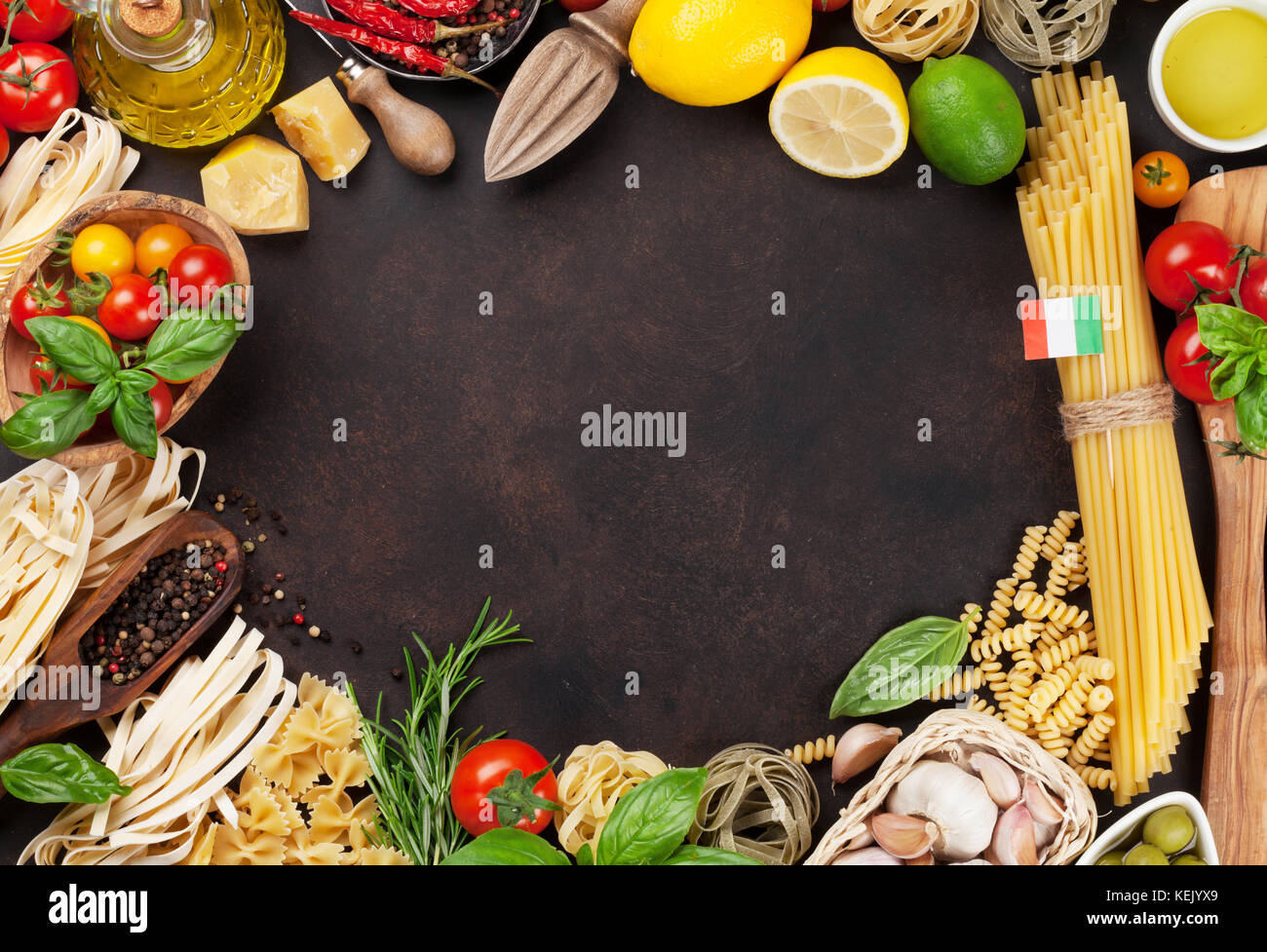 Italian food. Pasta ingredients on stone table. Top view with space for ...