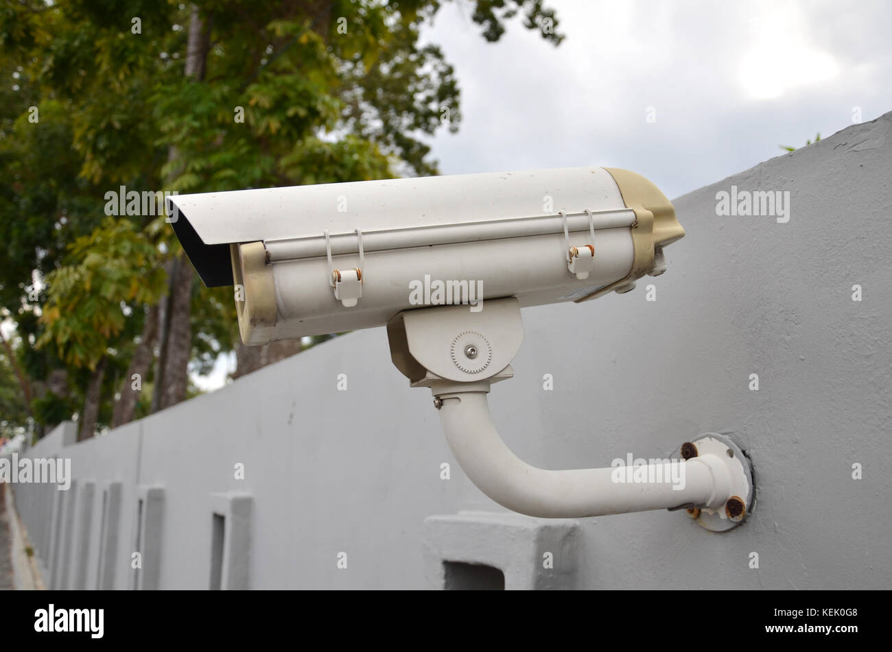 Outdoor Security cctv camera under Sun shine and White cloud in blue ...