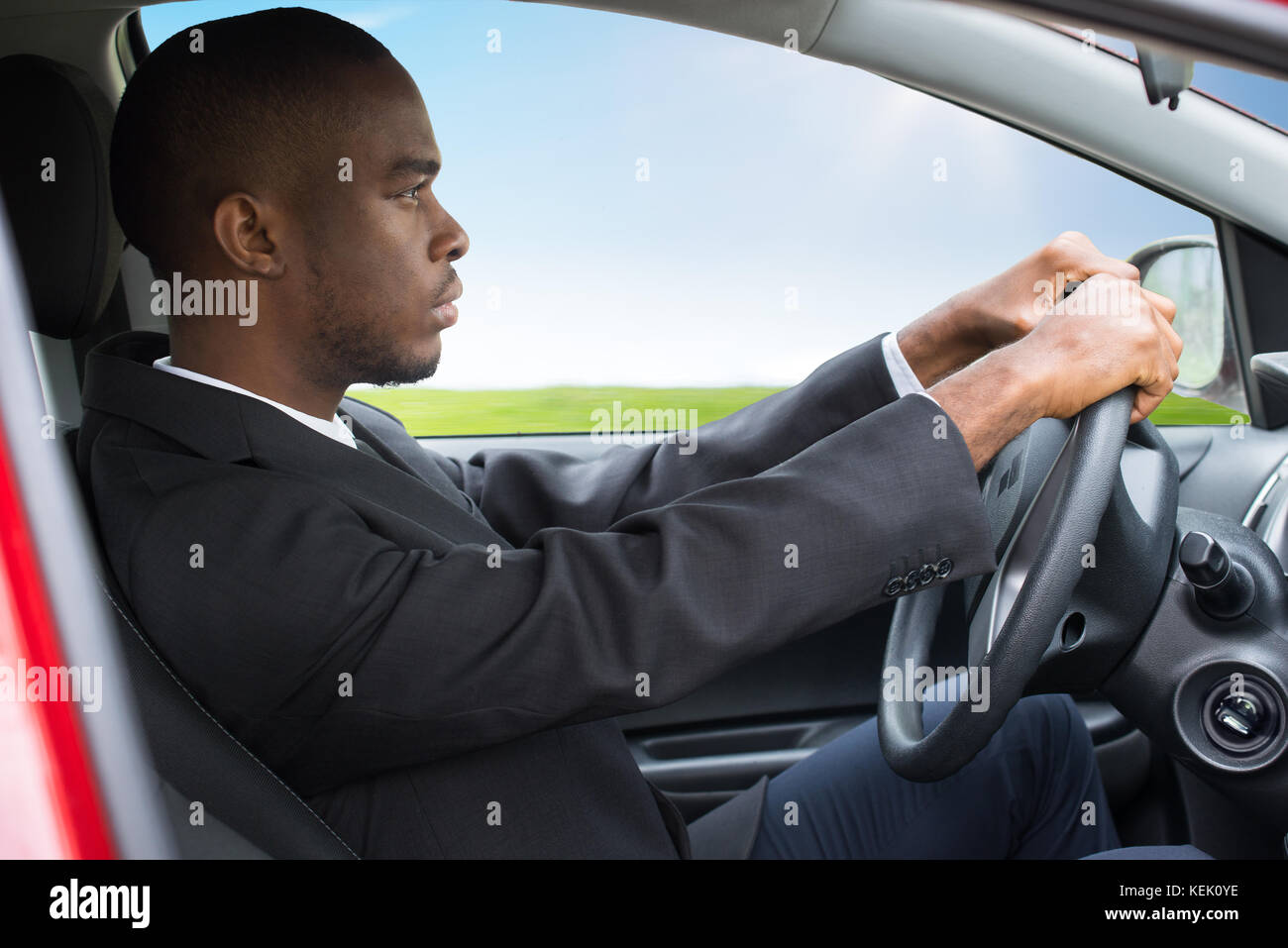 Man Driving Car Side View