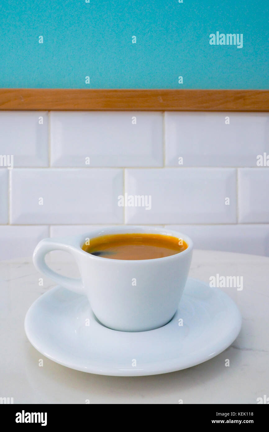cup of americano coffee ready to serve on the marble table in the ...