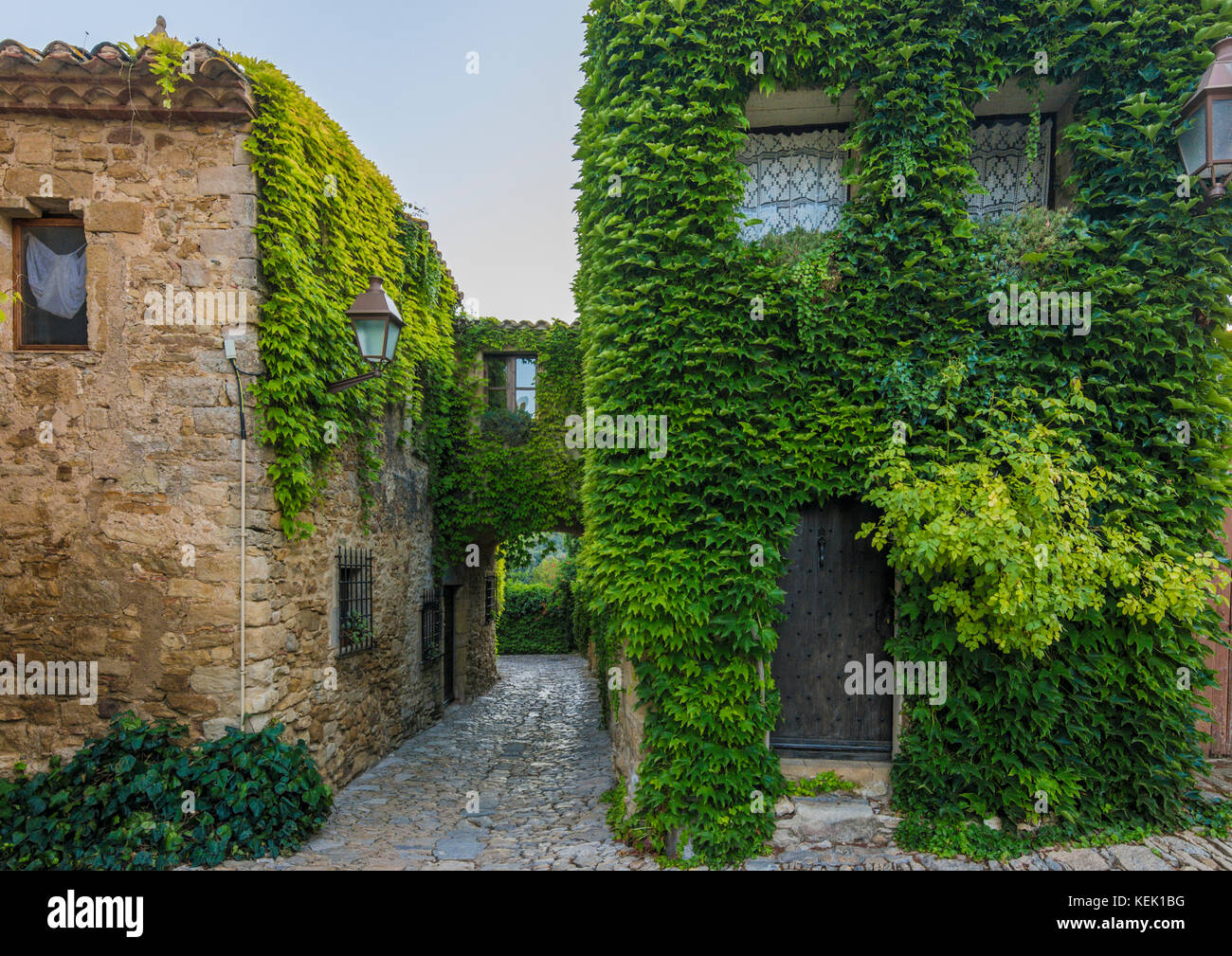 Narrow street in old medieval town of Peratallada, Spain Stock Photo ...