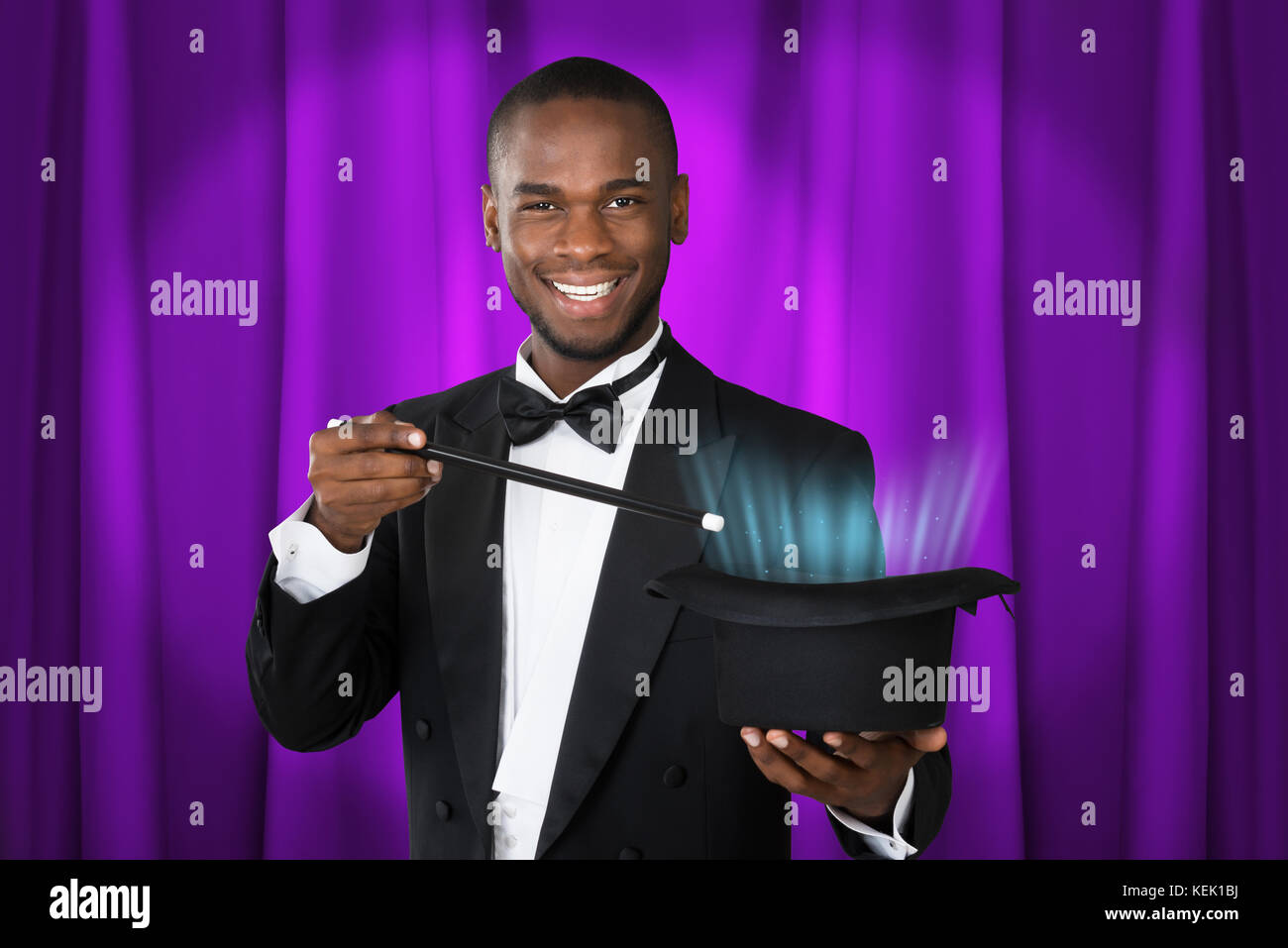 Young Happy Magician Showing Magic With Magic Wand And Hat Stock Photo ...