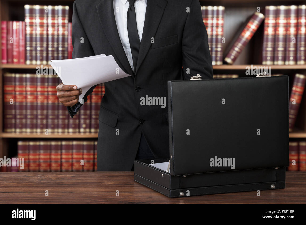 Close-up Of Male Lawyer Removing Papers From Briefcase In Office Stock ...