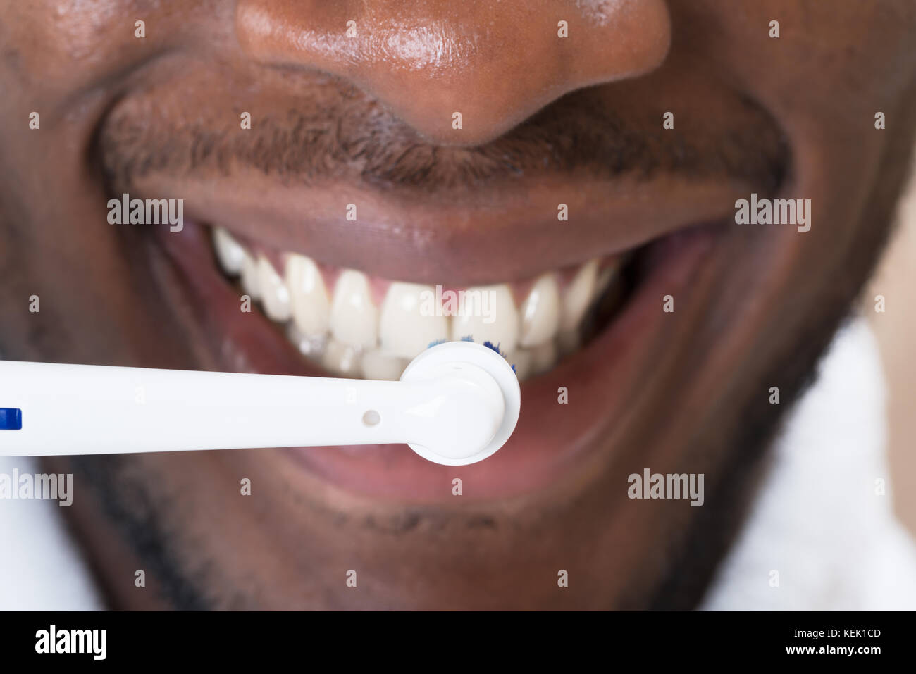 Close-up Of An African Man Cleaning His Teeth With Toothbrush Stock ...
