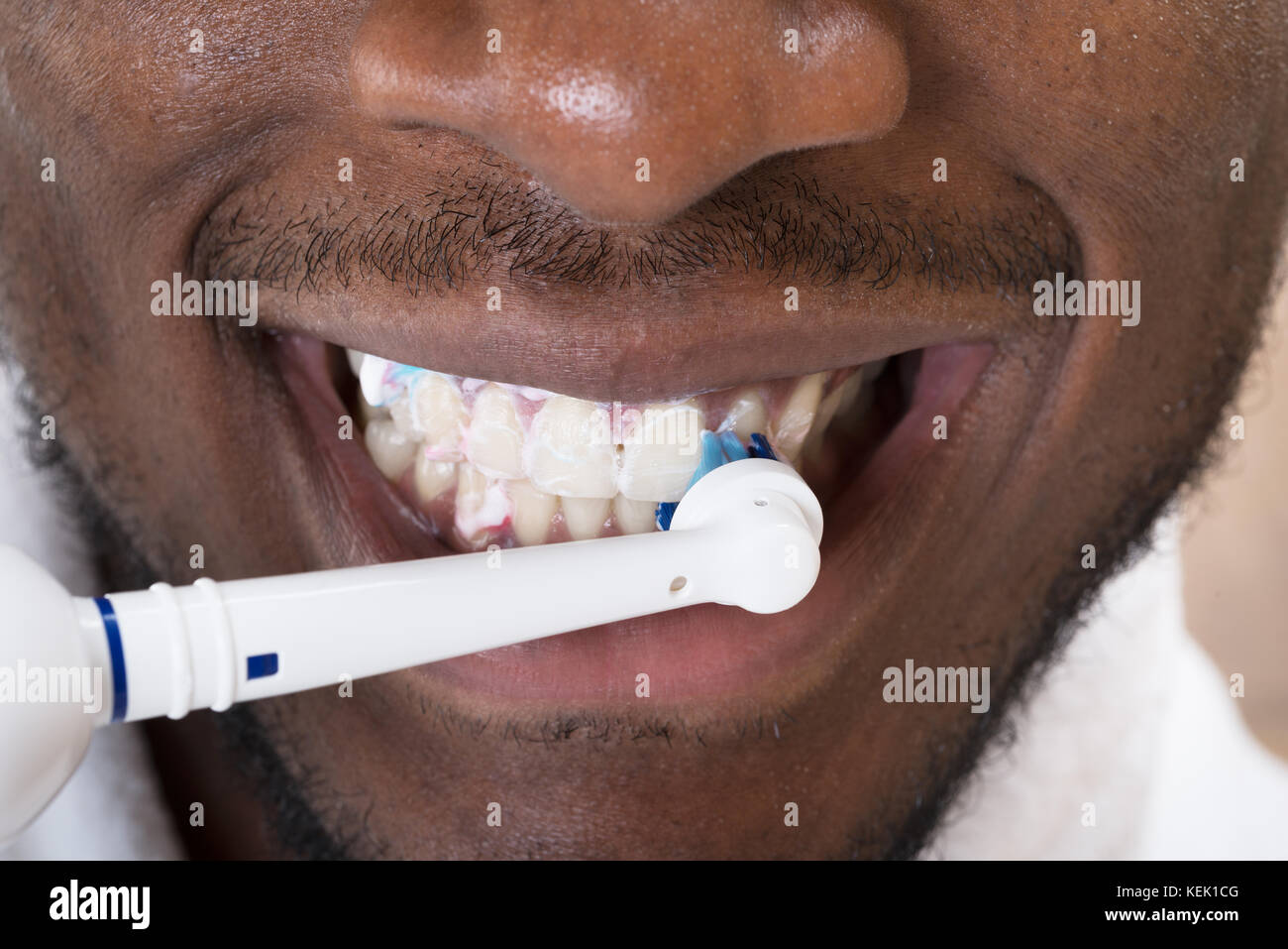 Close-up Of An African Man Cleaning His Teeth With Toothbrush Stock ...