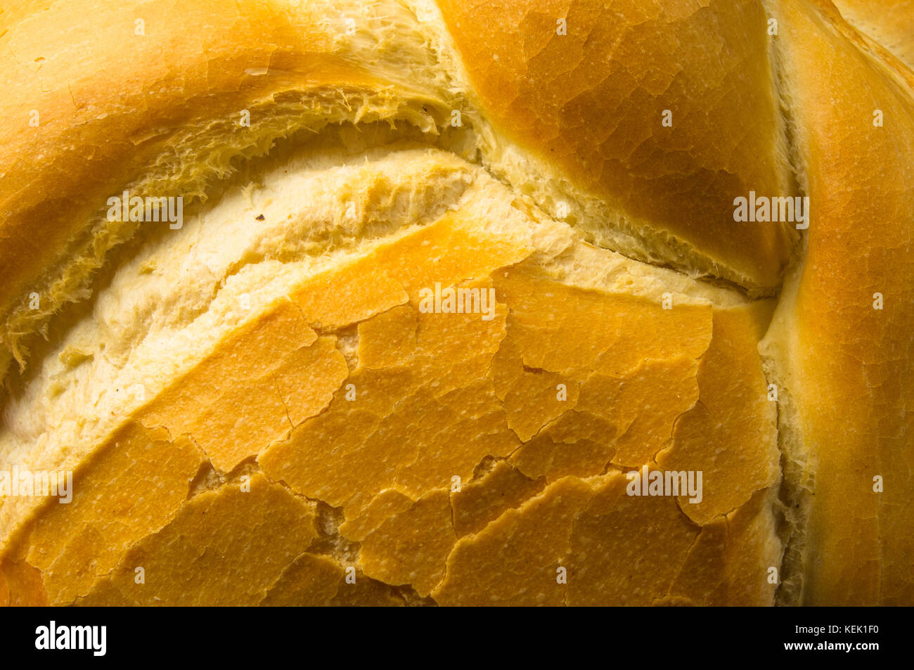 fresh braided loaf of white wheat bread on an orange napkin Stock Photo ...