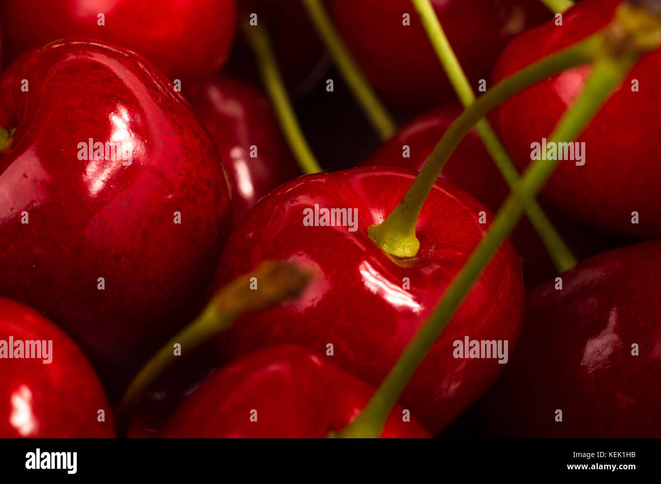 large ripe red sweet cherries in a dish of stainless steel, close-up ...