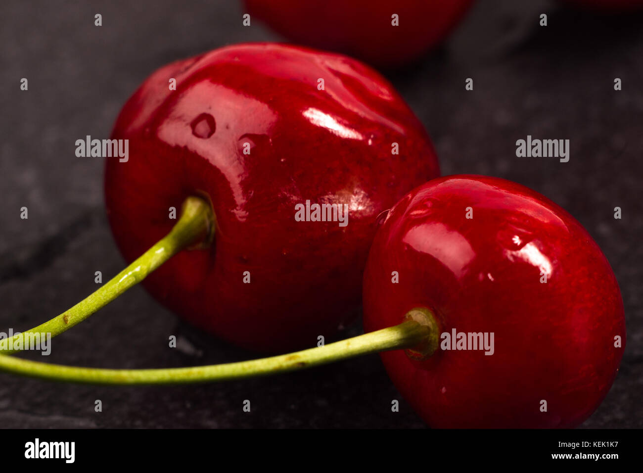 large ripe red sweet cherries in a dish of stainless steel, close-up ...