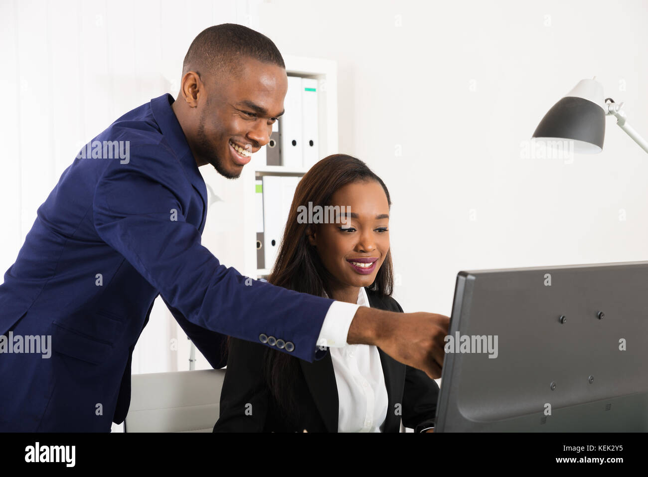 Young African Businesspeople Working On Computer At Office Stock Photo ...