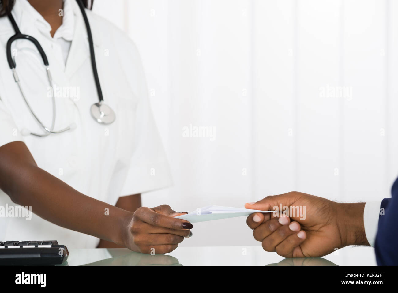 Close-up Of Doctor Giving A Prescription To His Patient In Diagnostic ...