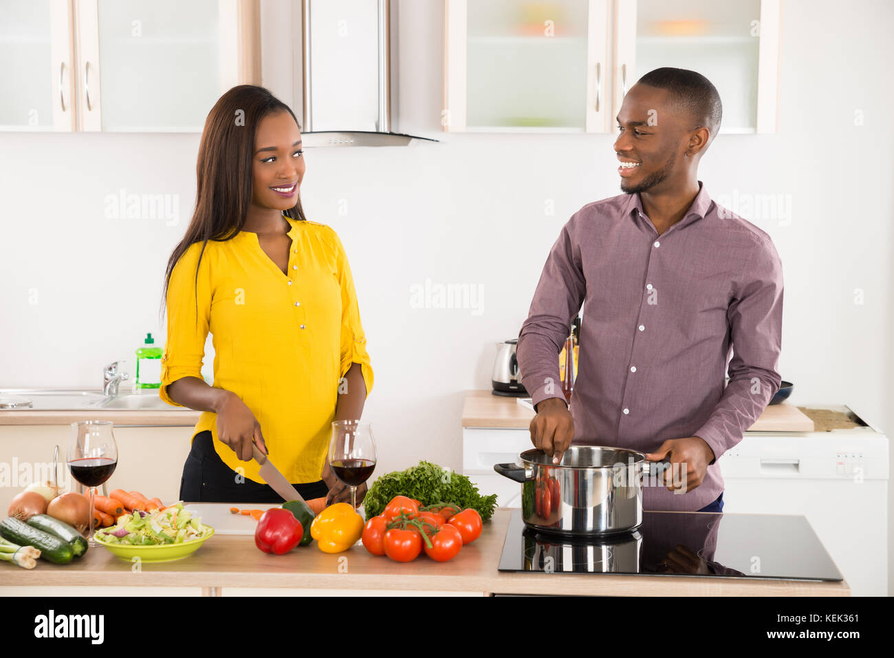 African woman cooking dinner hi-res stock photography and images - Alamy