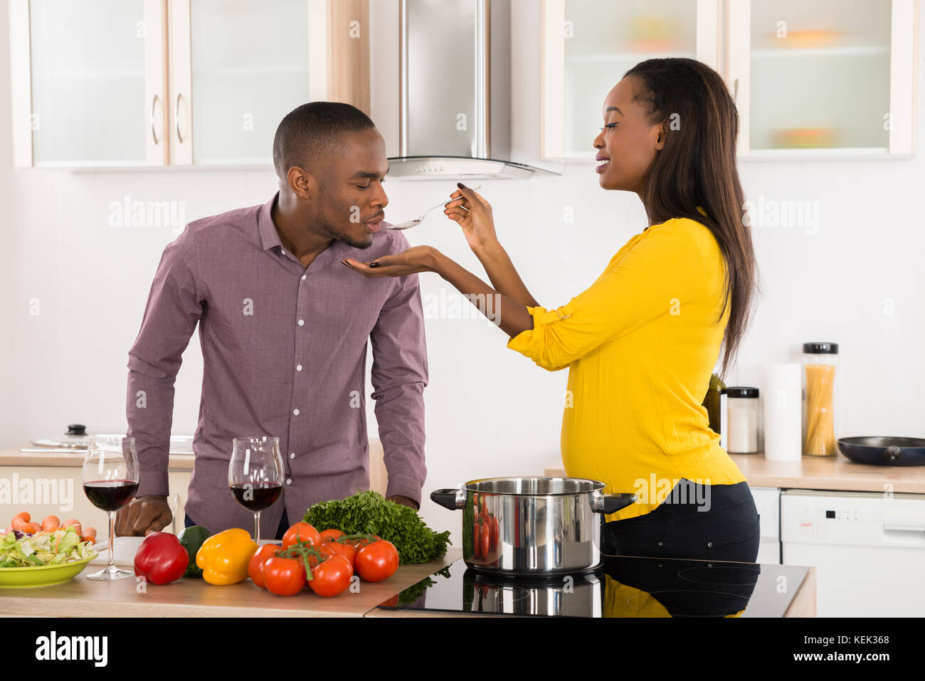 Photo Of Young Man Testing Food In Kitchen Stock Photo - Alamy