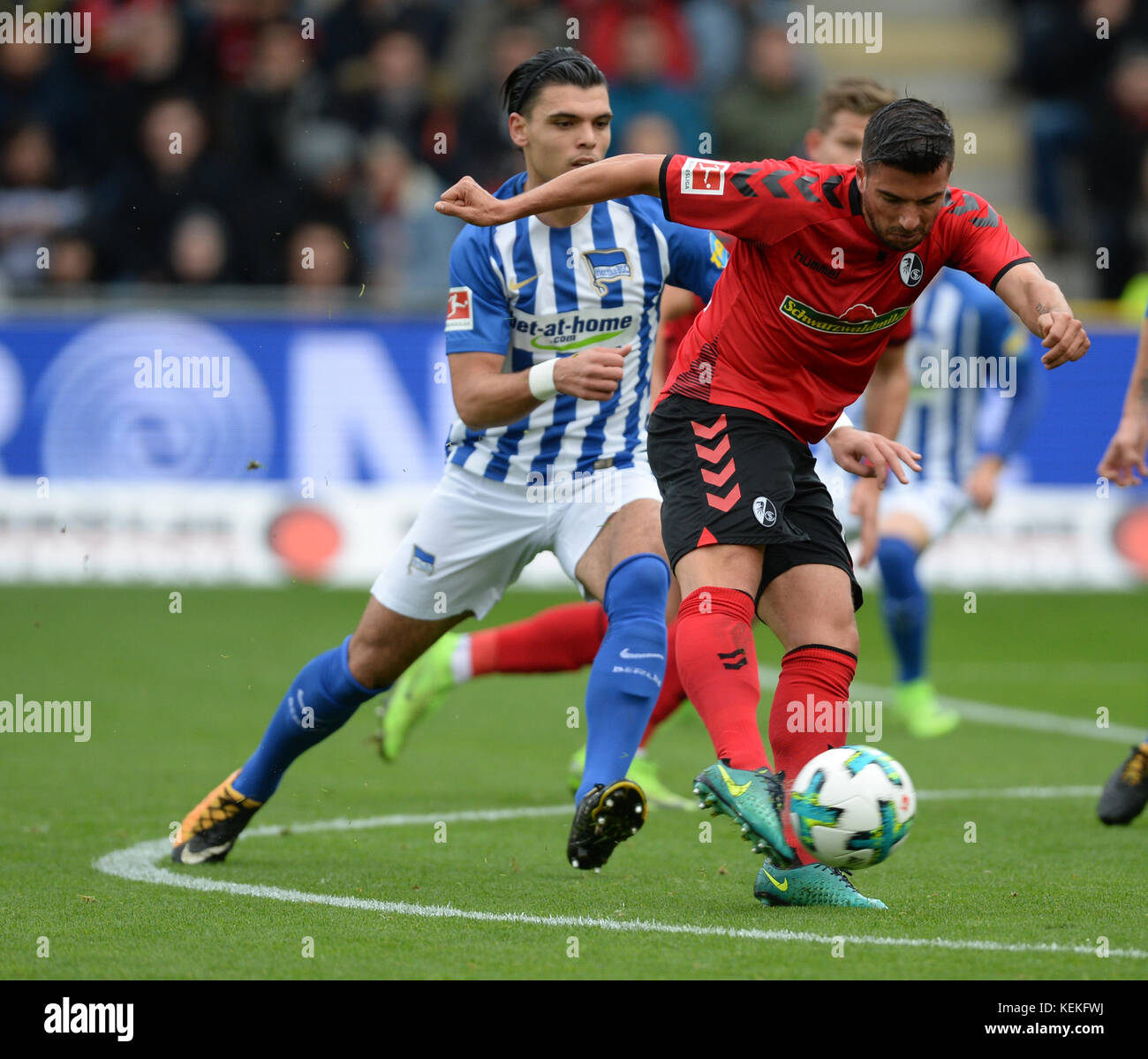 Freiburg, Germany. 22nd Oct, 2017. Berlin's Karim Rekik (l) and ...