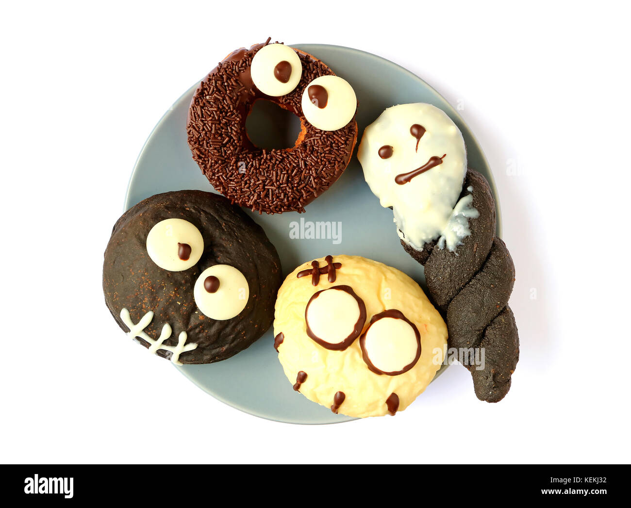 Halloween Ghosts and Monsters Shaped Doughnuts Served on the Plate ...